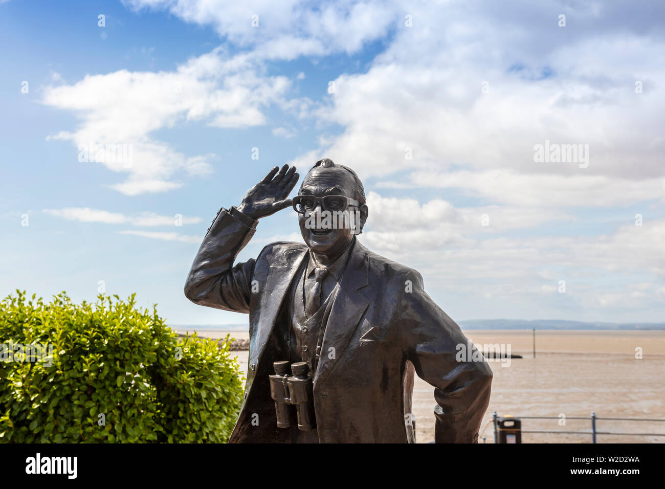 Bronze statue of famous English comedian Eric Morecambe at the seafront ...