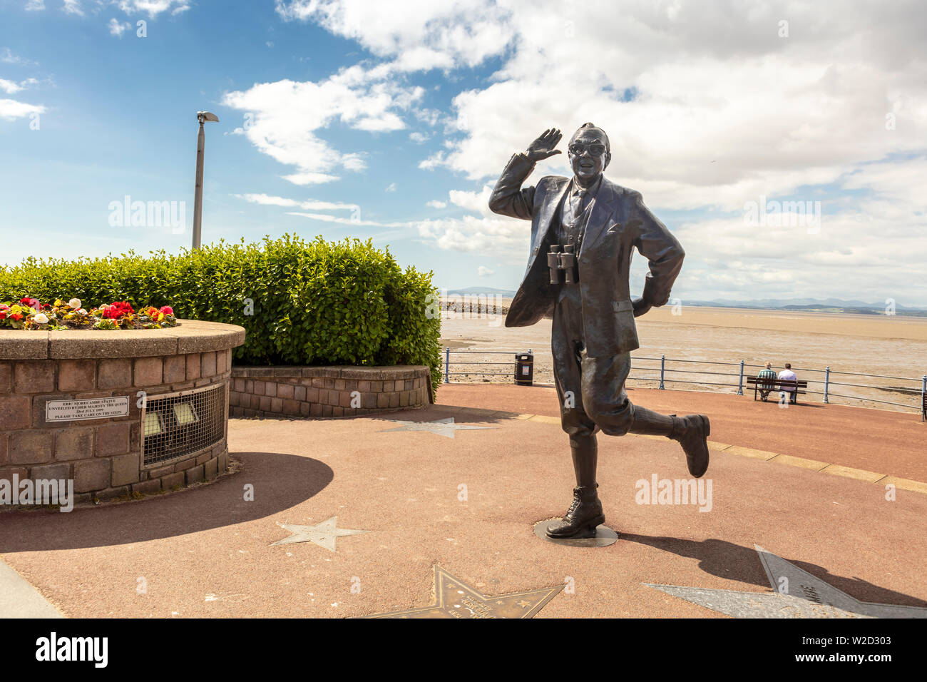 Bronze statue of famous English comedian Eric Morecambe at the seafront ...