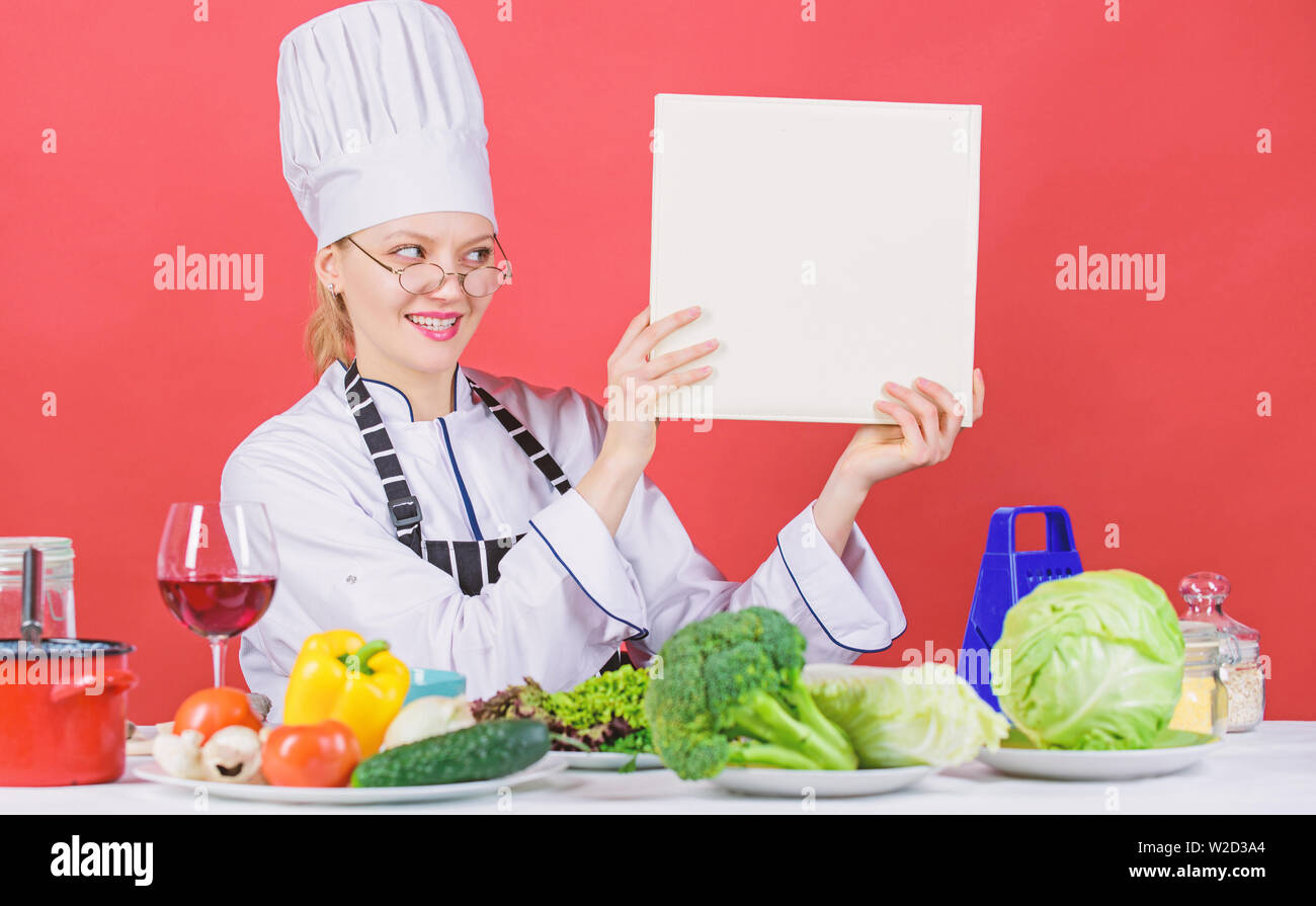 Culinary school concept. Female in hat and apron knows everything about ...