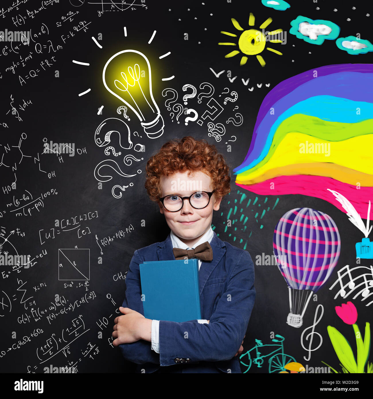 Creativity education. Clever child boy in suit and glasses holding ...