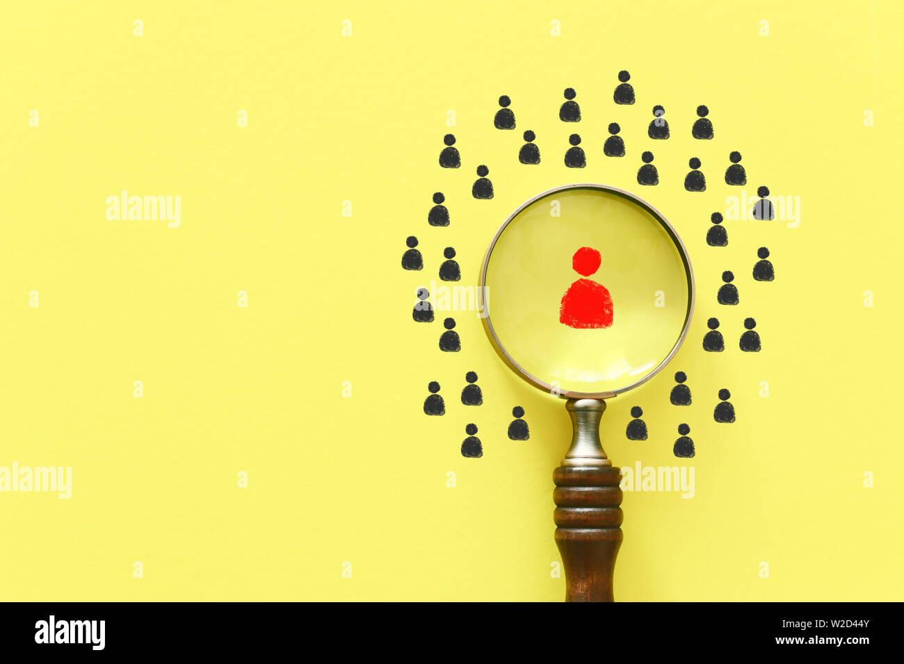 business image of magnifying glass with people icon over yellow ...