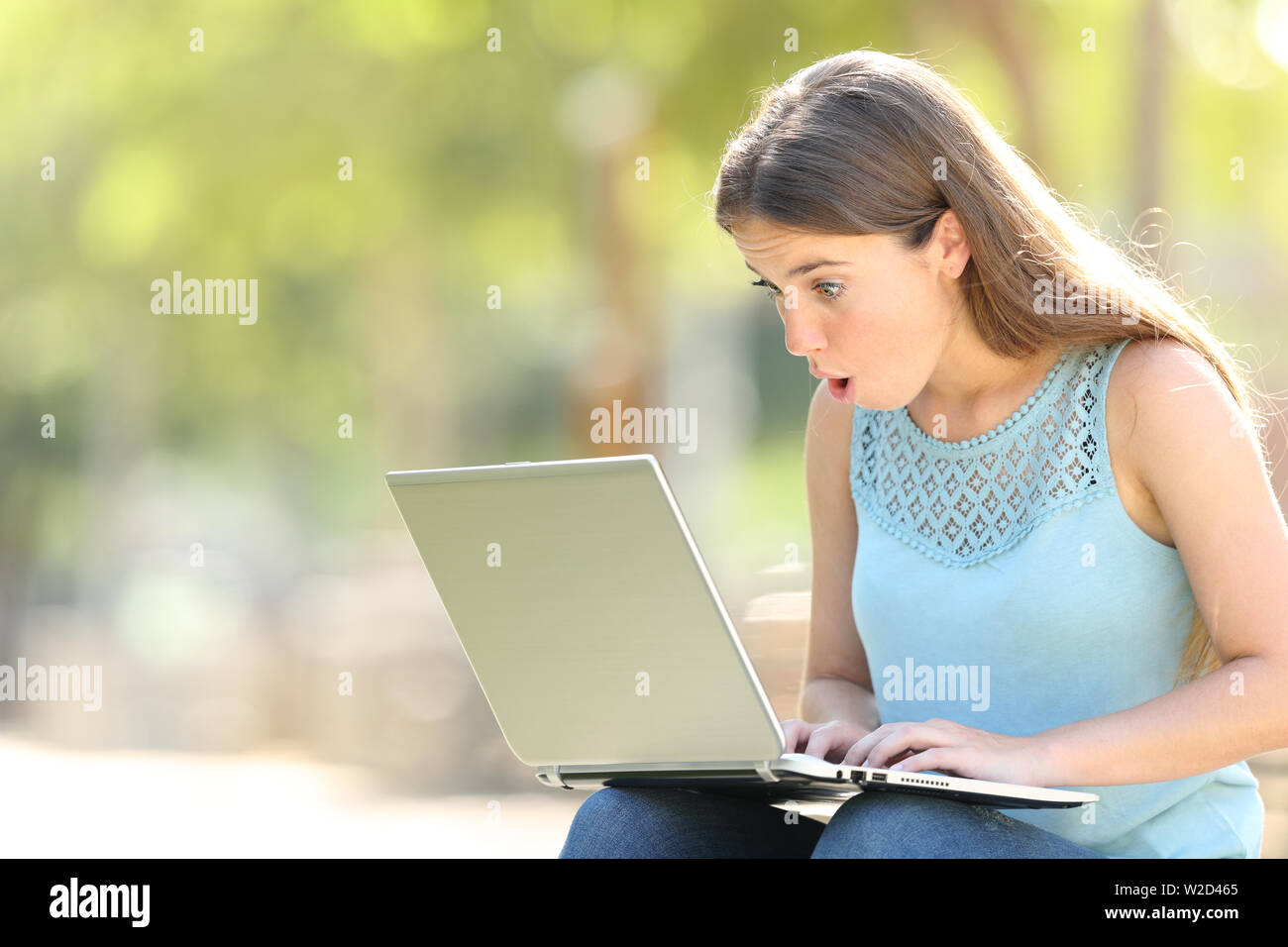 Surprised astonished woman laptop hi-res stock photography and images ...