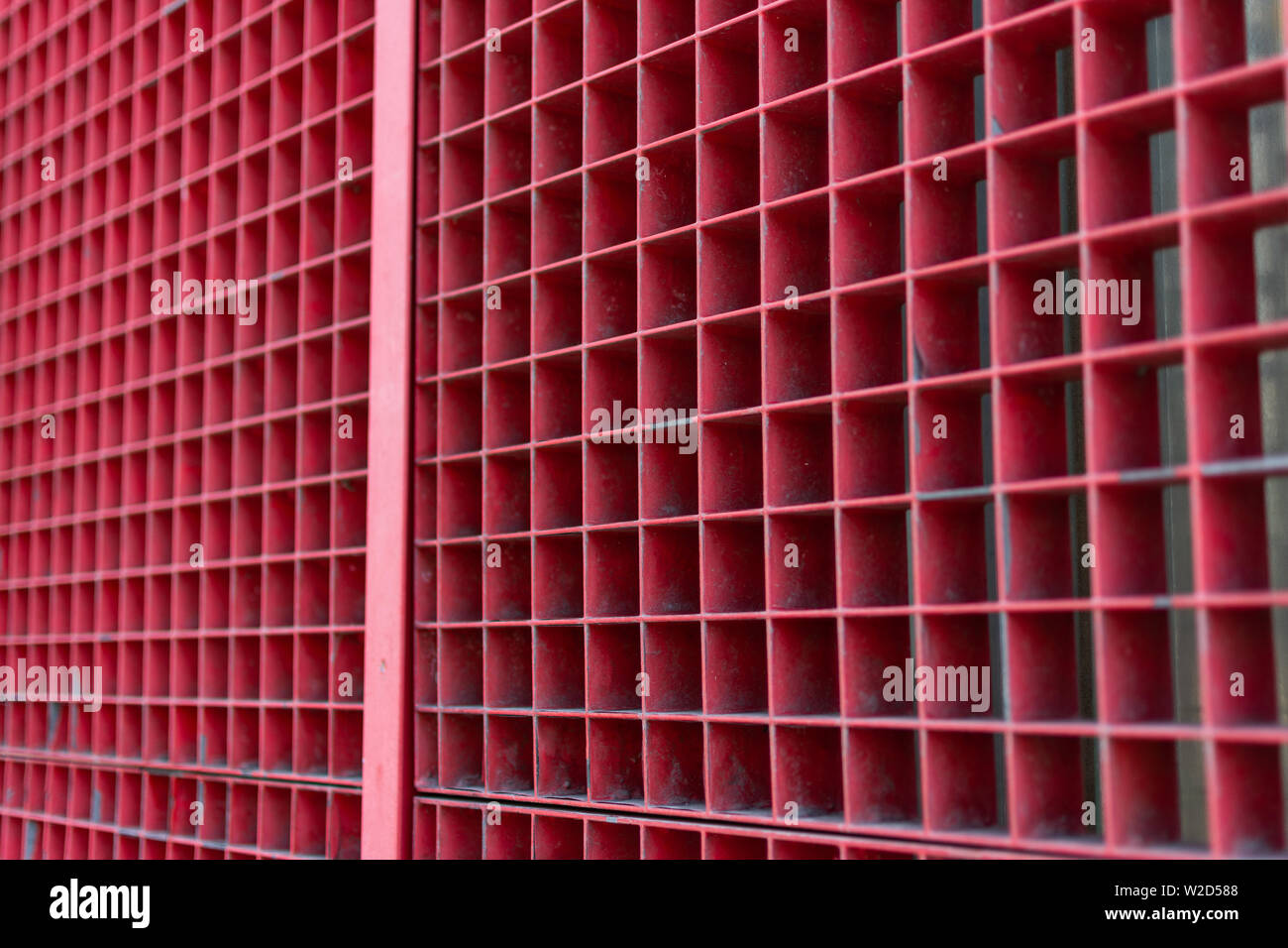 Abstract background with square red iron grid Stock Photo - Alamy