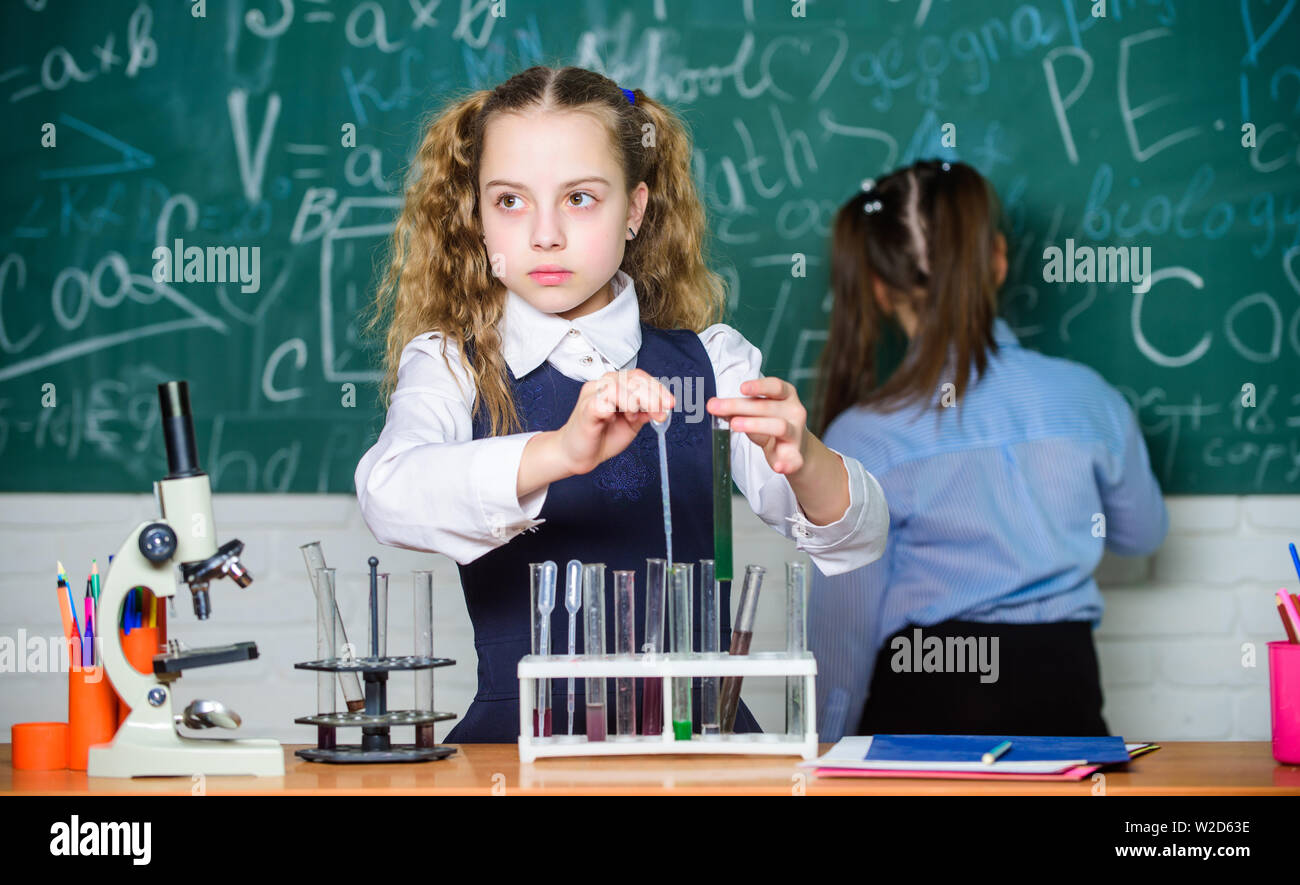 Smart and confident children. Chemistry lesson. students doing biology ...