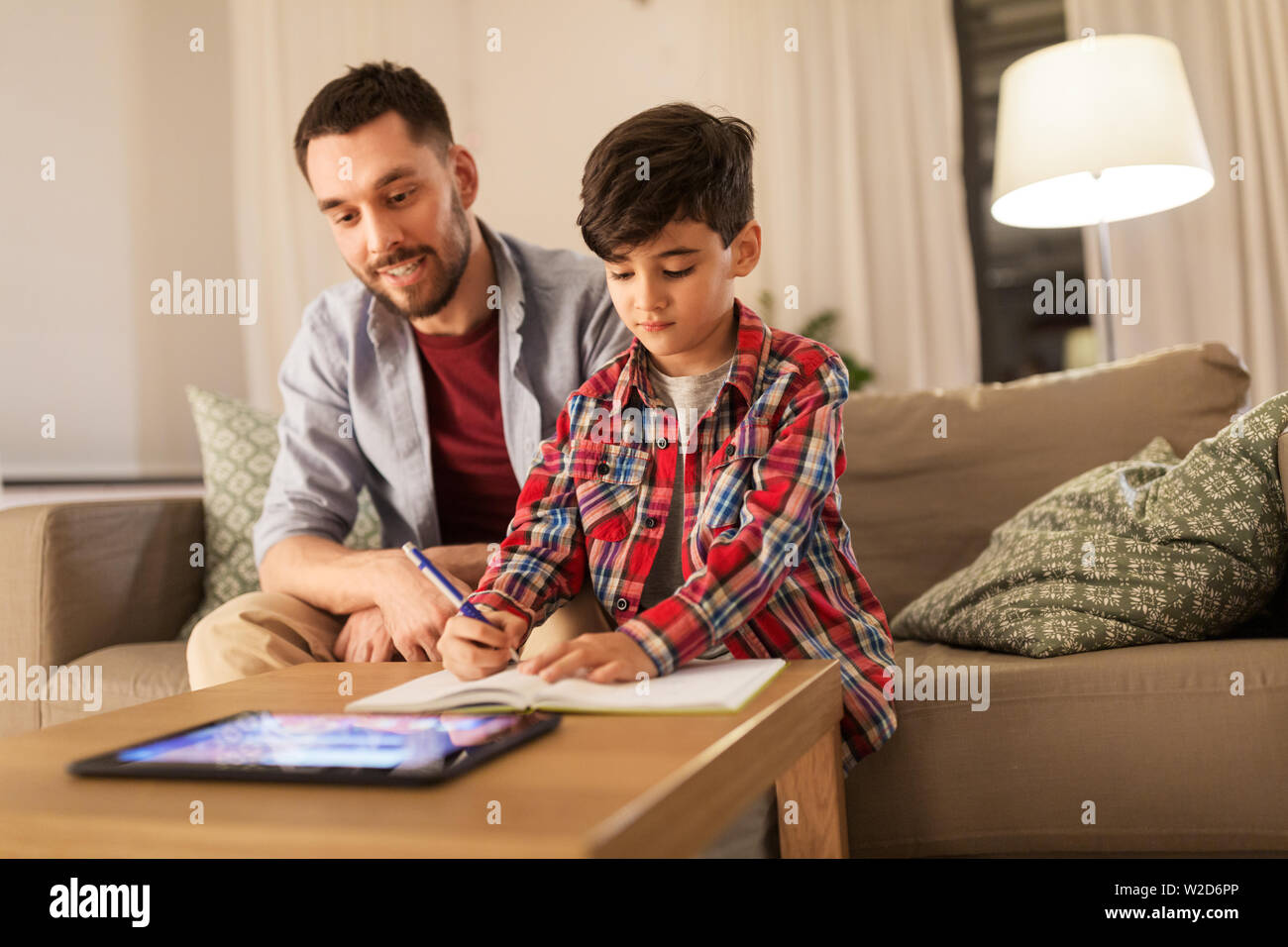 father and son doing homework together Stock Photo - Alamy