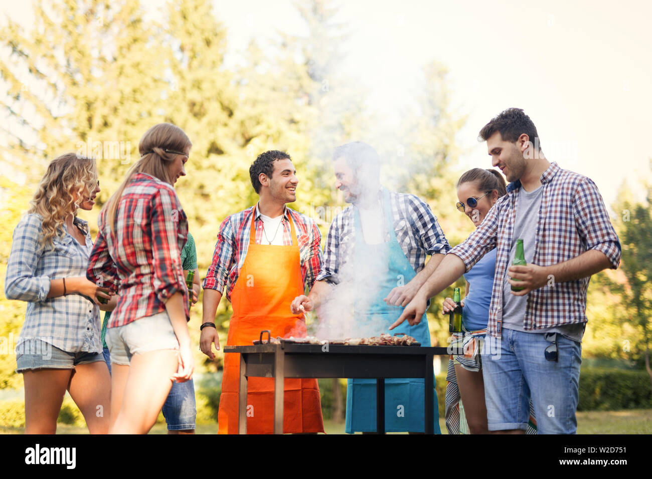 Young and happy people in nature having fun Stock Photo - Alamy