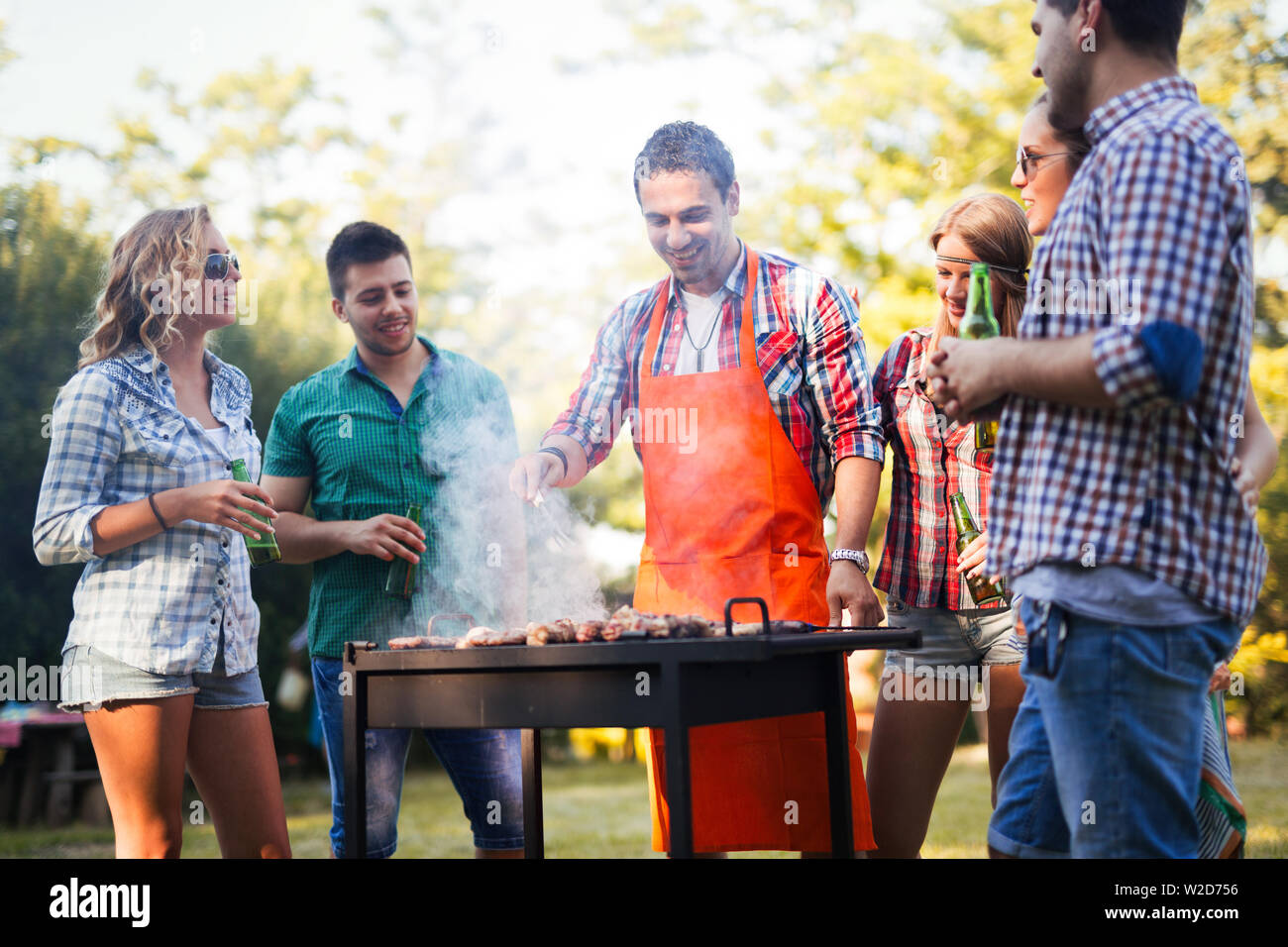 Young and happy people in nature having fun Stock Photo - Alamy