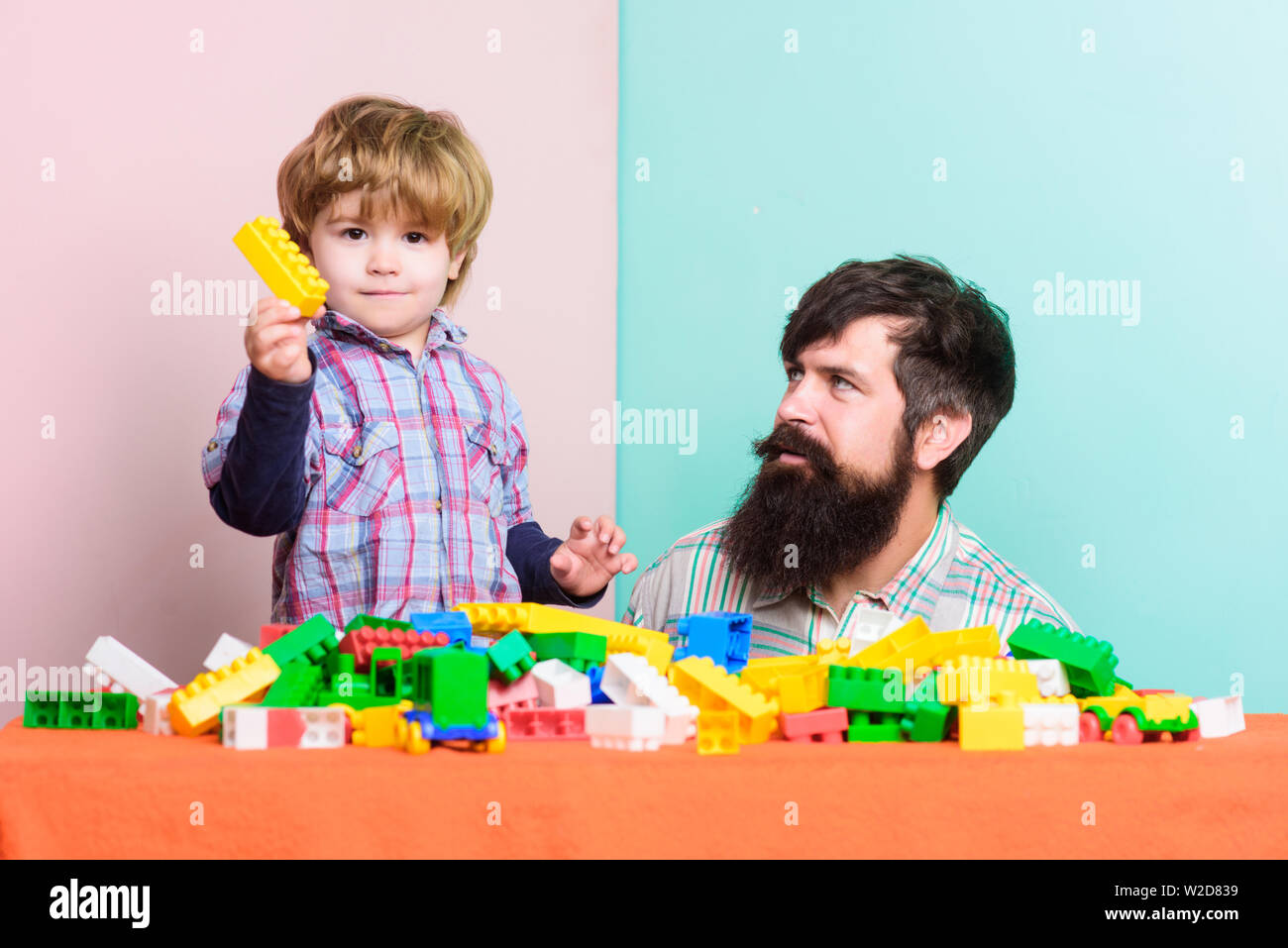 building home with constructor. happy family. leisure time. father and ...