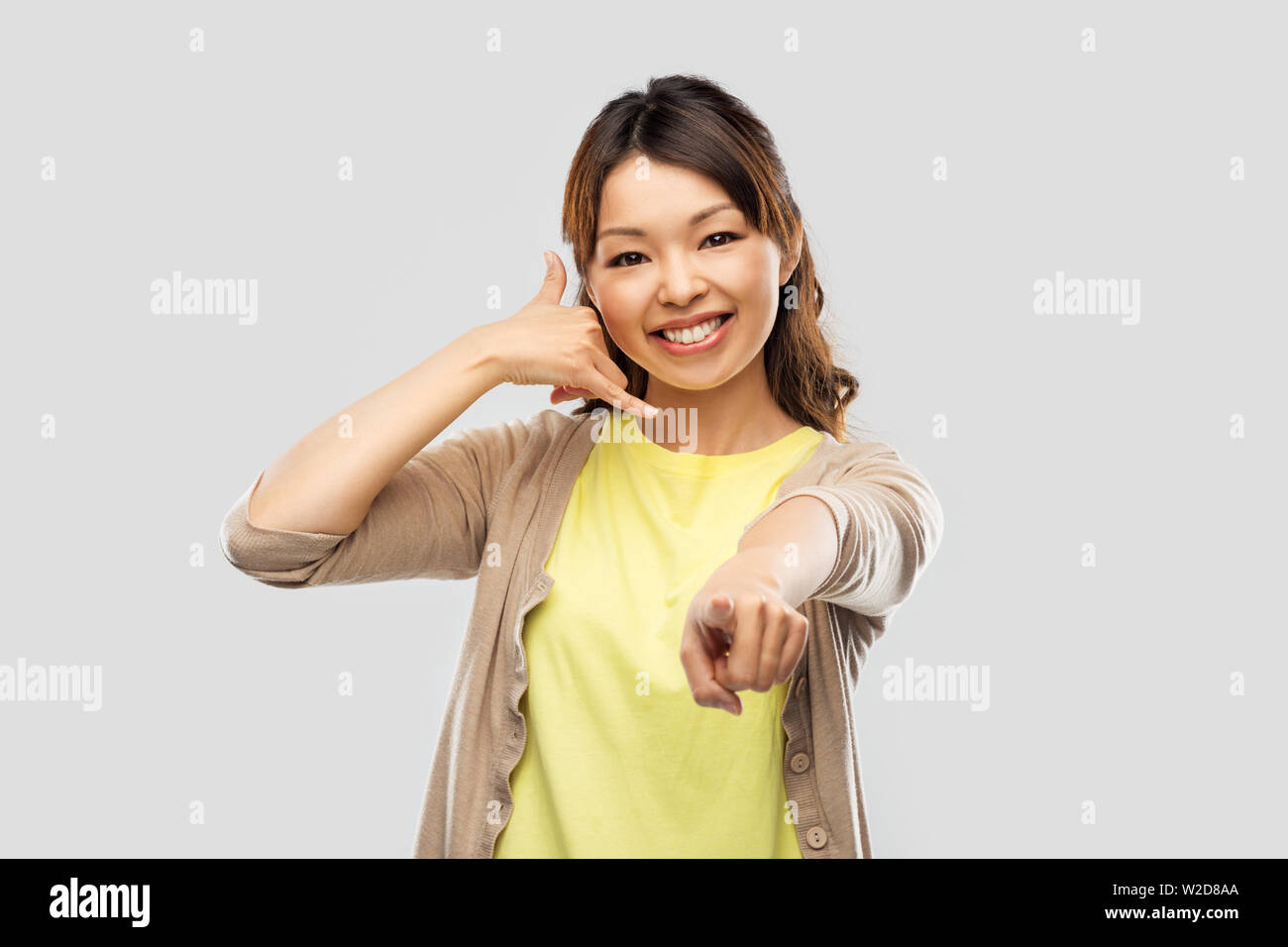 Woman making shaka hand gesture hi-res stock photography and images - Alamy
