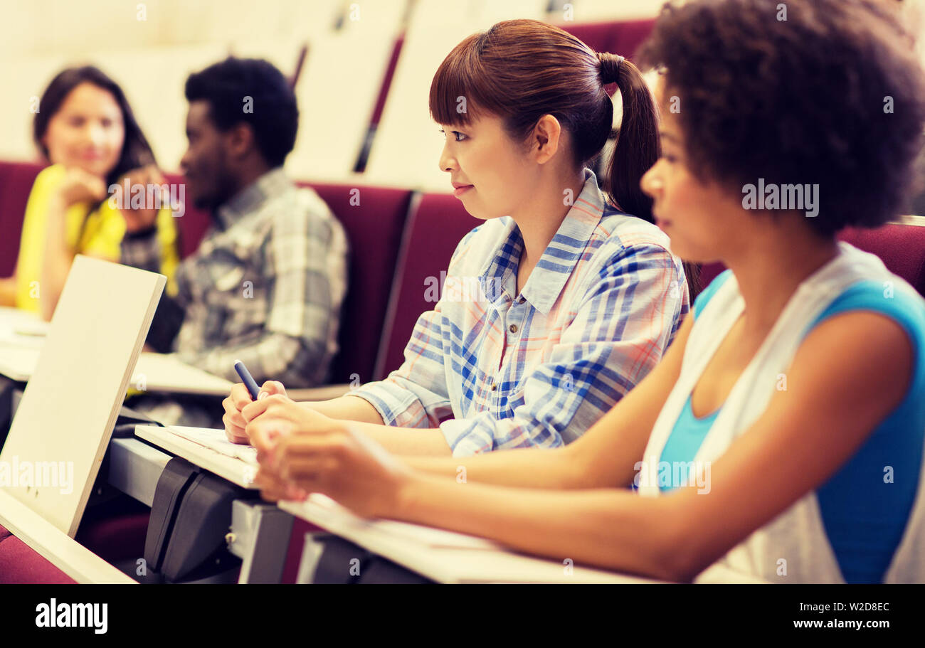 group of students talking in lecture hall Stock Photo - Alamy