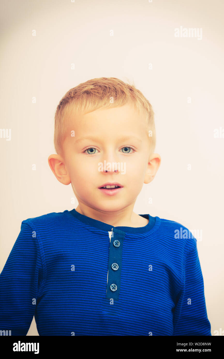 Face expressions, children concept. Portrait of happy kid boy looking ...