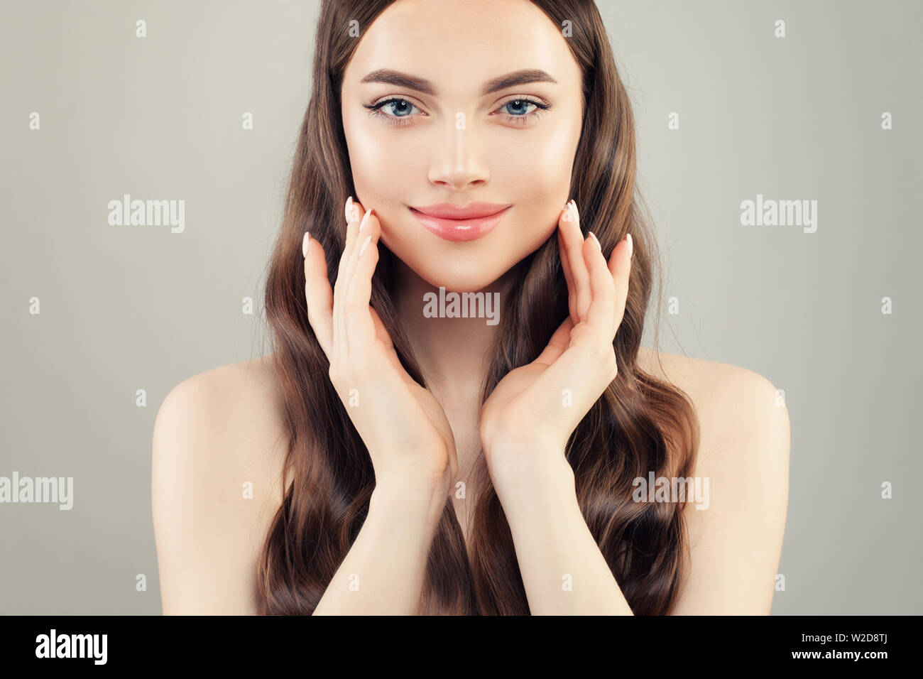 Beautiful woman touching her hand her cheeks. Pretty face closeup Stock ...