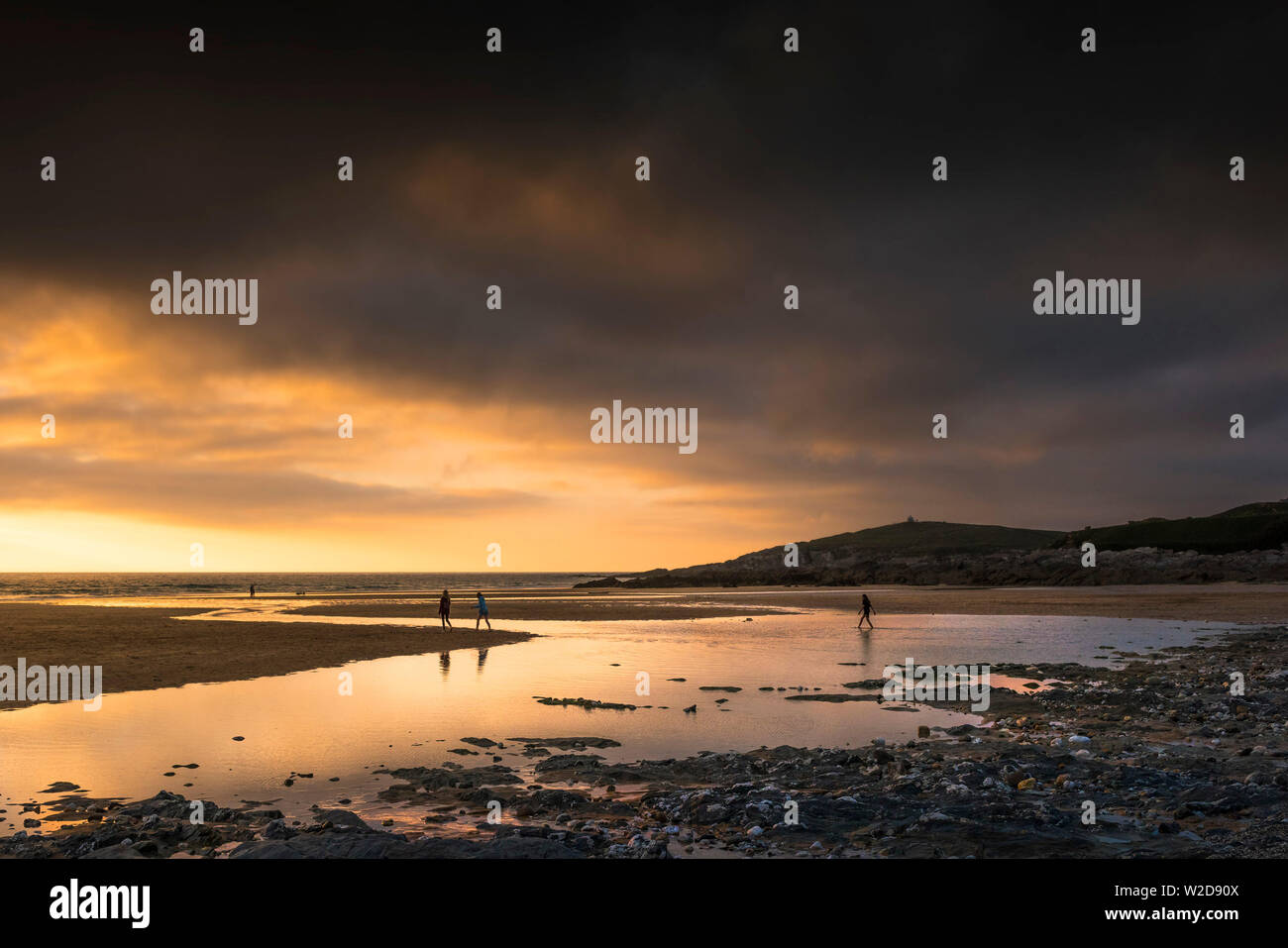 A beautiful golden sunset at Fistral Beach in Newquay in Cornwall Stock ...