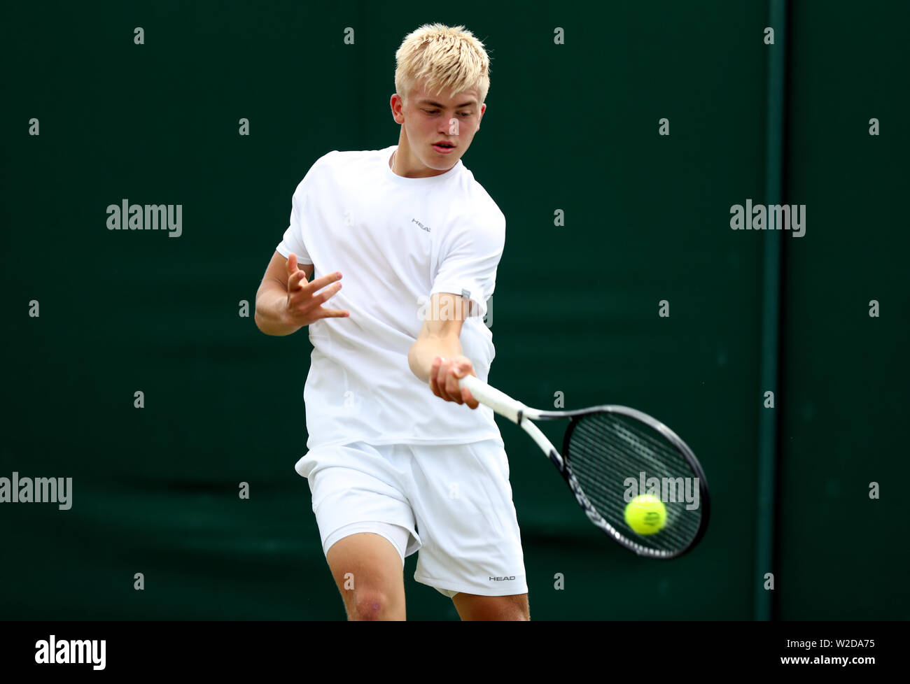 Felix Gill in action against Nicolas Alvarez Varona in the boys singles ...