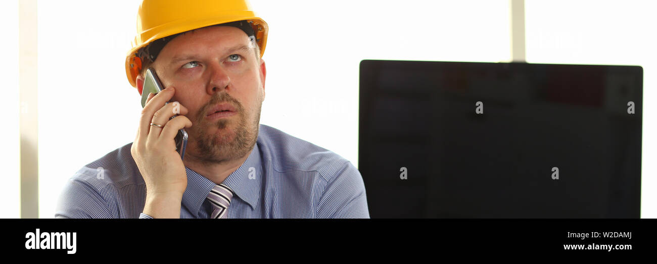Construction Worker Sit in Engineering Office Stock Photo - Alamy