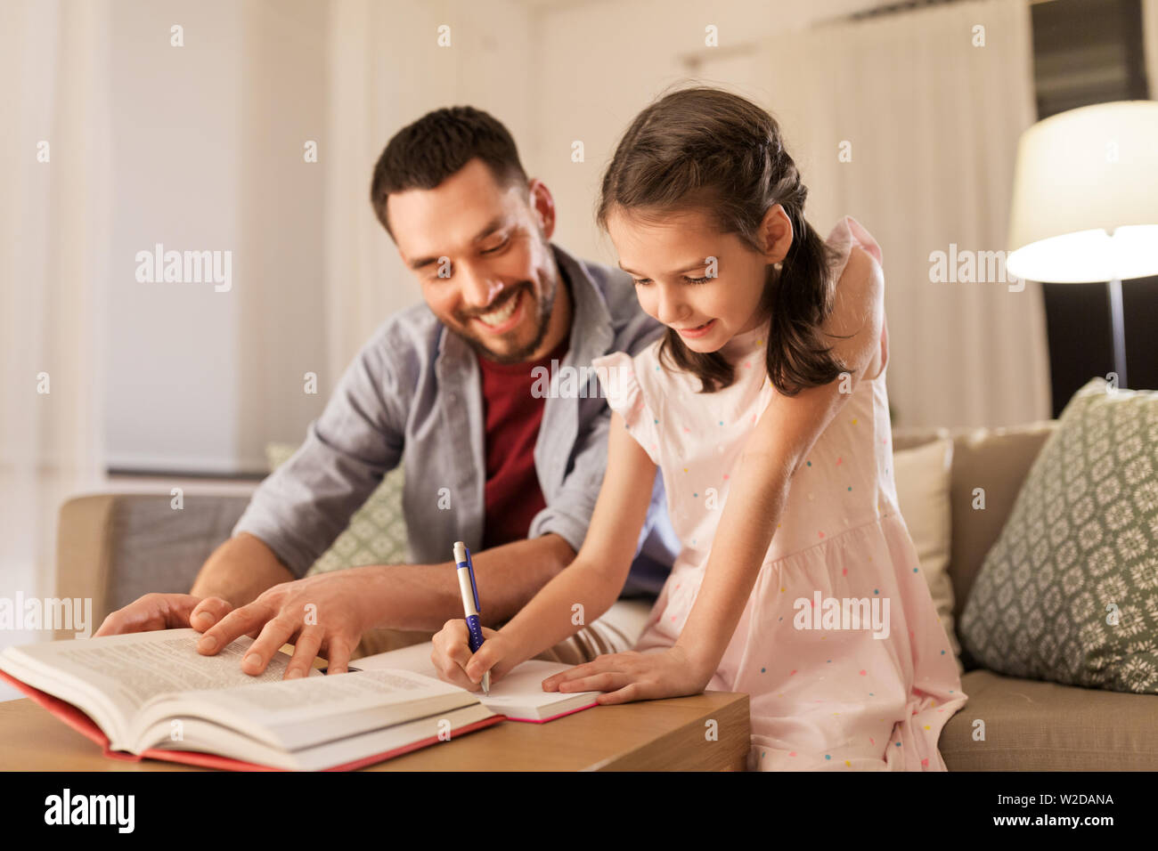 father and daughter doing homework together Stock Photo - Alamy