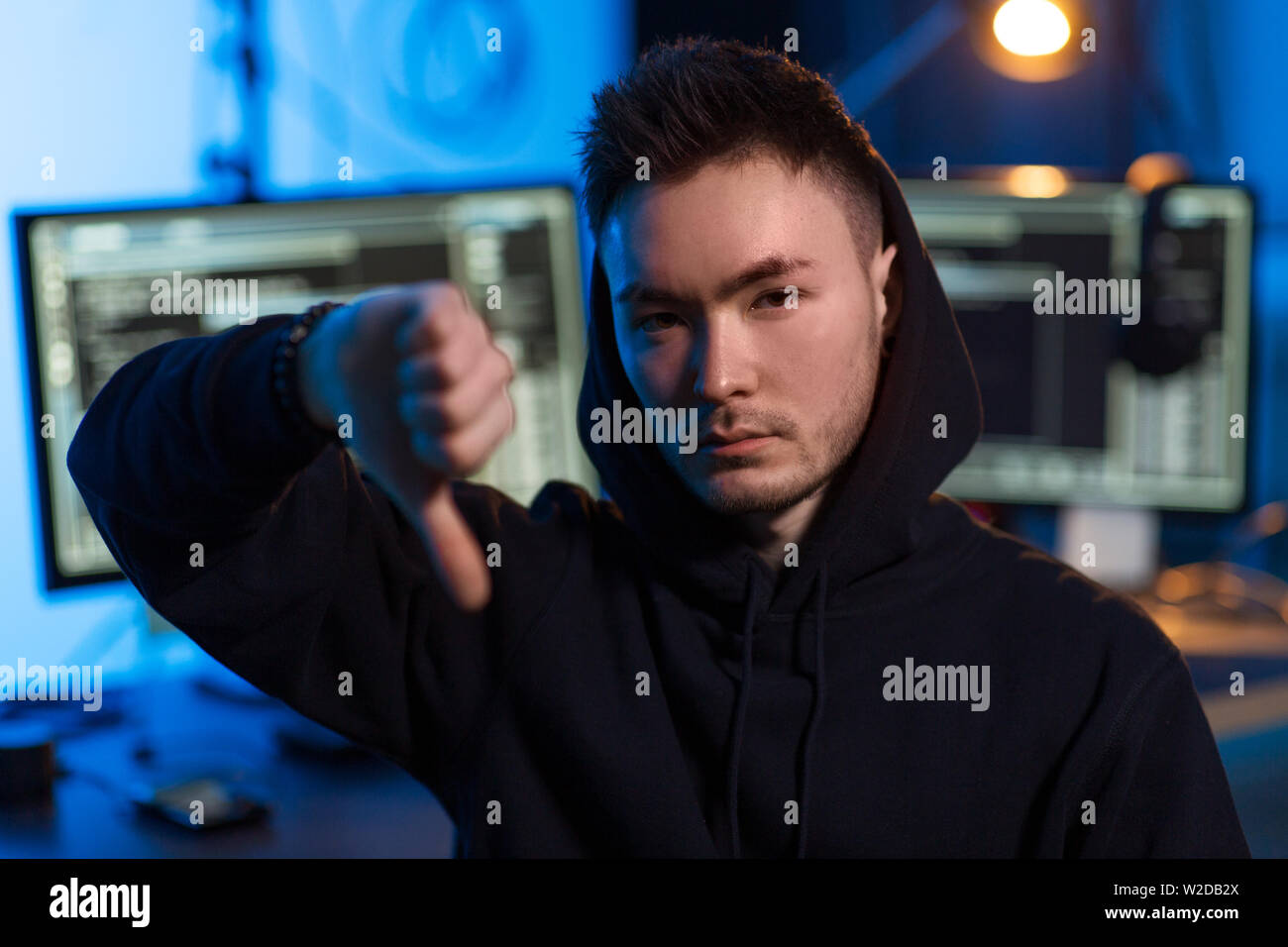 asian hacker in dark room with computers at night Stock Photo - Alamy