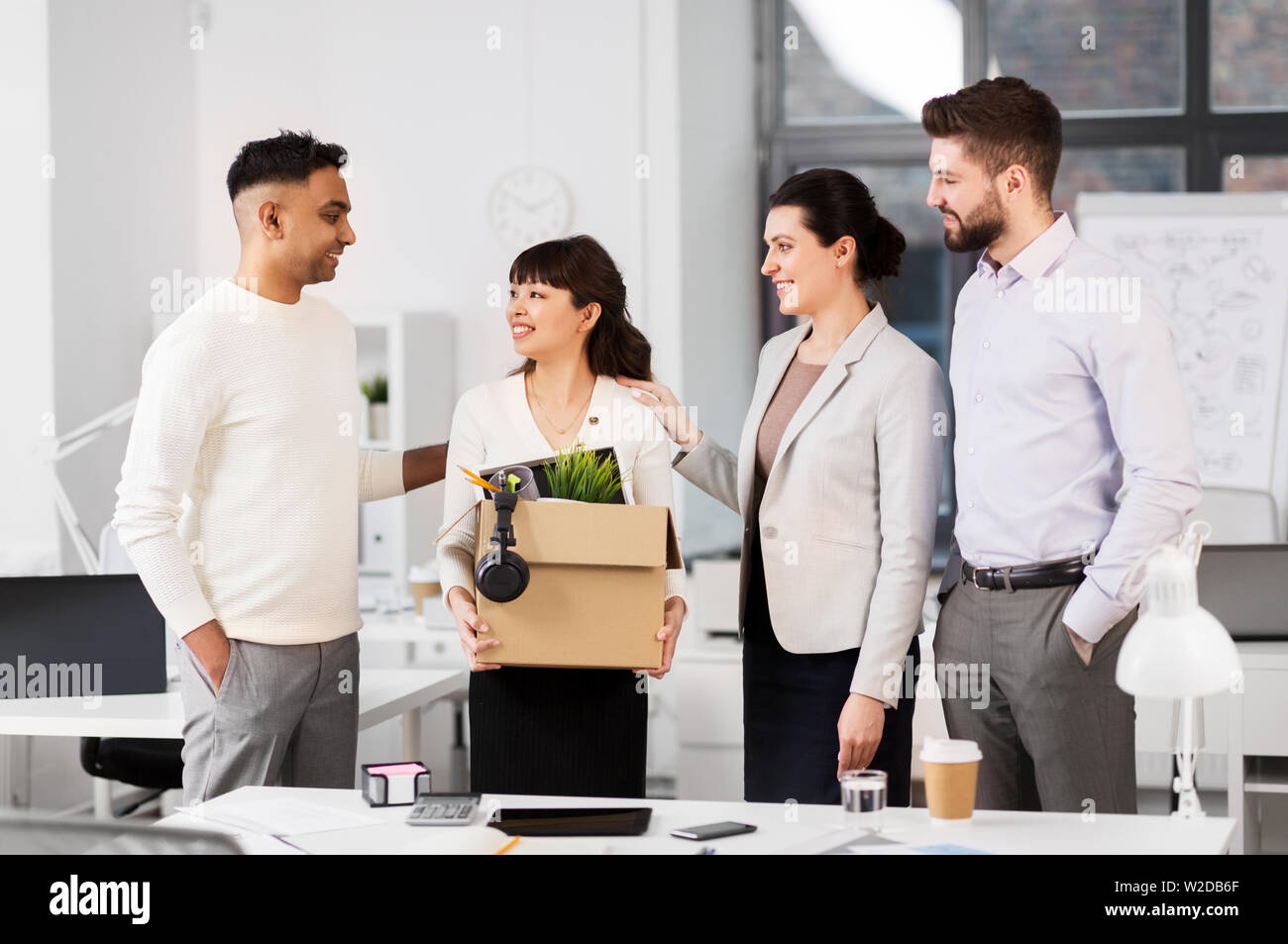 new female employee with colleagues at office Stock Photo - Alamy