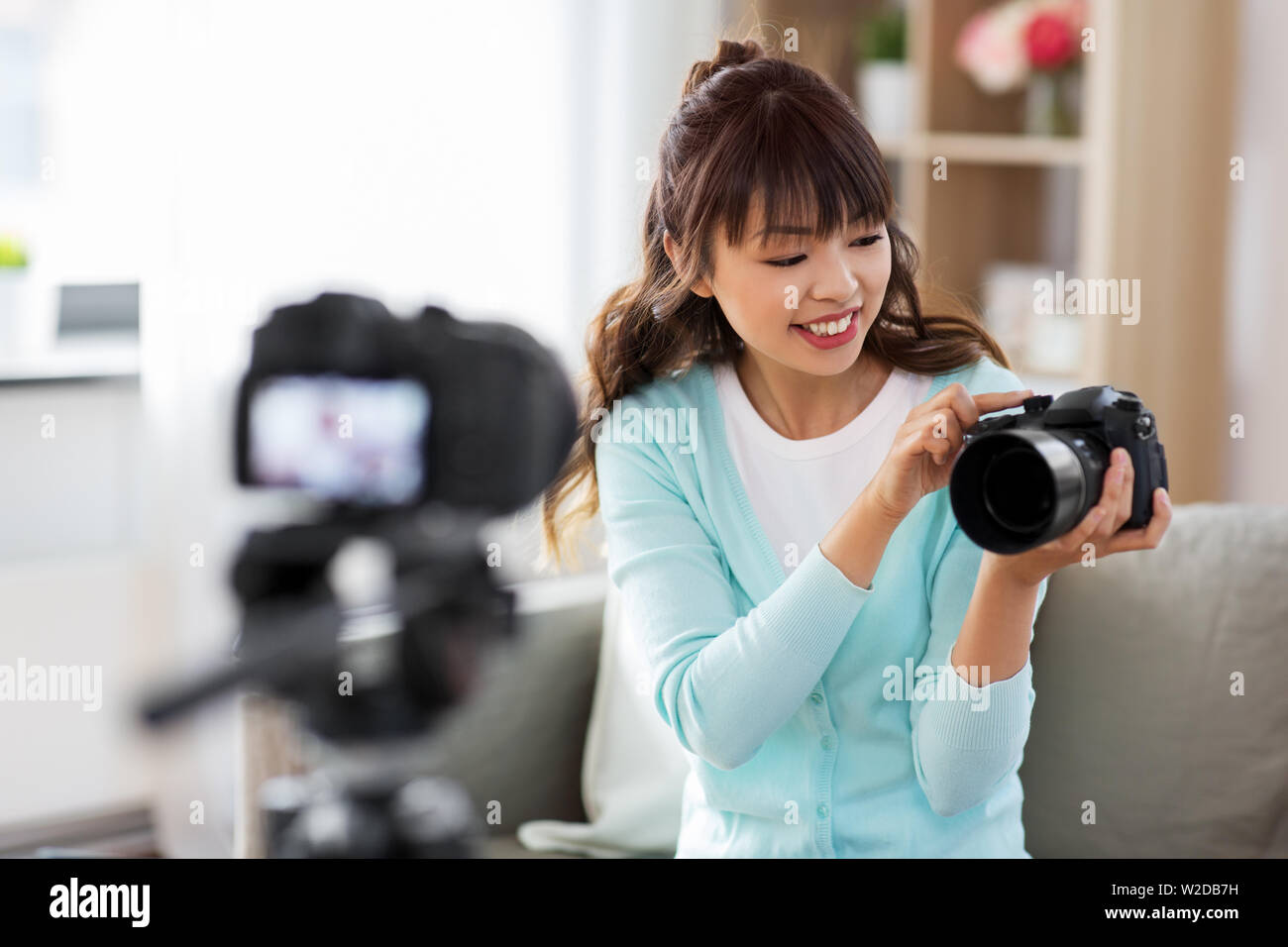asian female blogger with camera recording video Stock Photo - Alamy