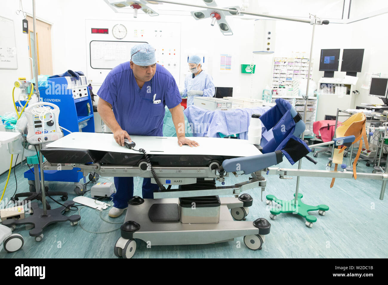Hospital nurses prepare an operating theatre for the next patient Stock ...