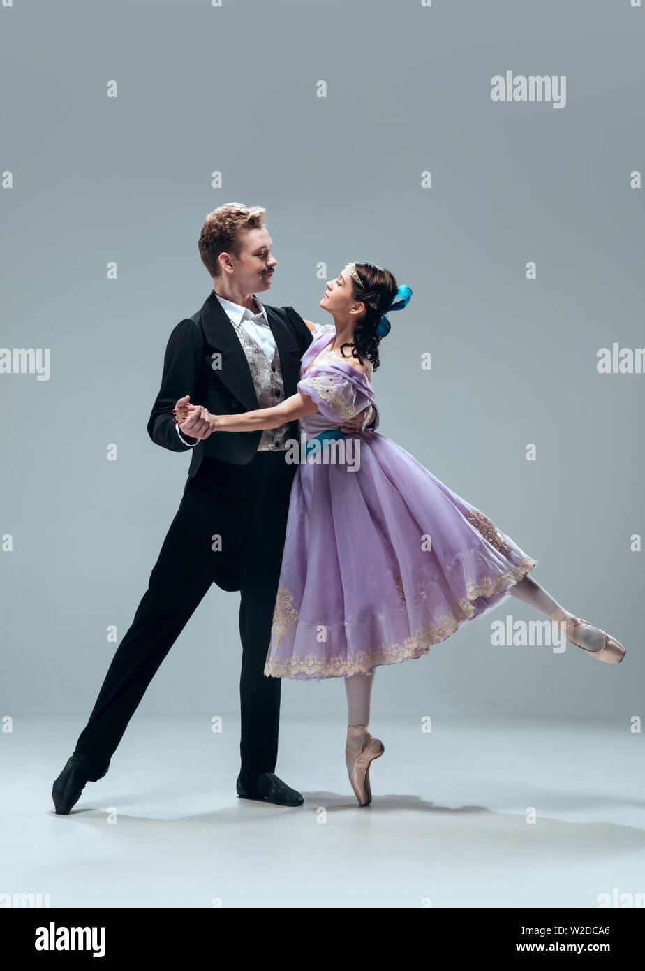 Moving together. Beautiful contemporary ballroom dancers isolated on ...