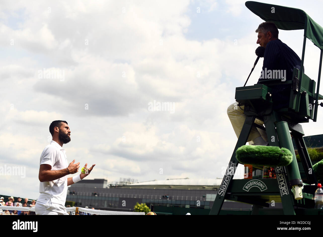 Benoit Paire speaks to the match umpire John Blom during his match on ...