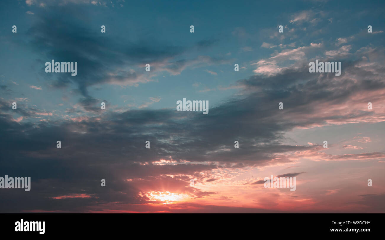 Cloudy sky at sunset, natural background photo Stock Photo - Alamy