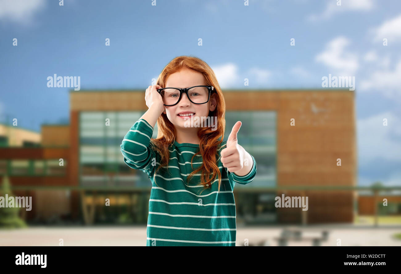 red haired student girl in glasses over school Stock Photo - Alamy