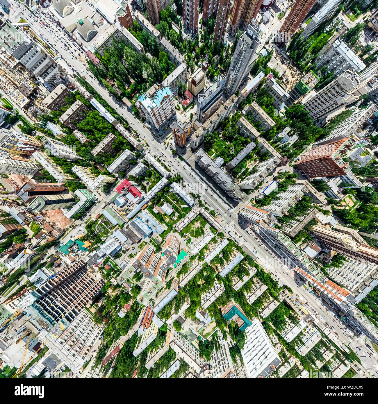 Aerial city view with crossroads and roads, houses, buildings, parks ...