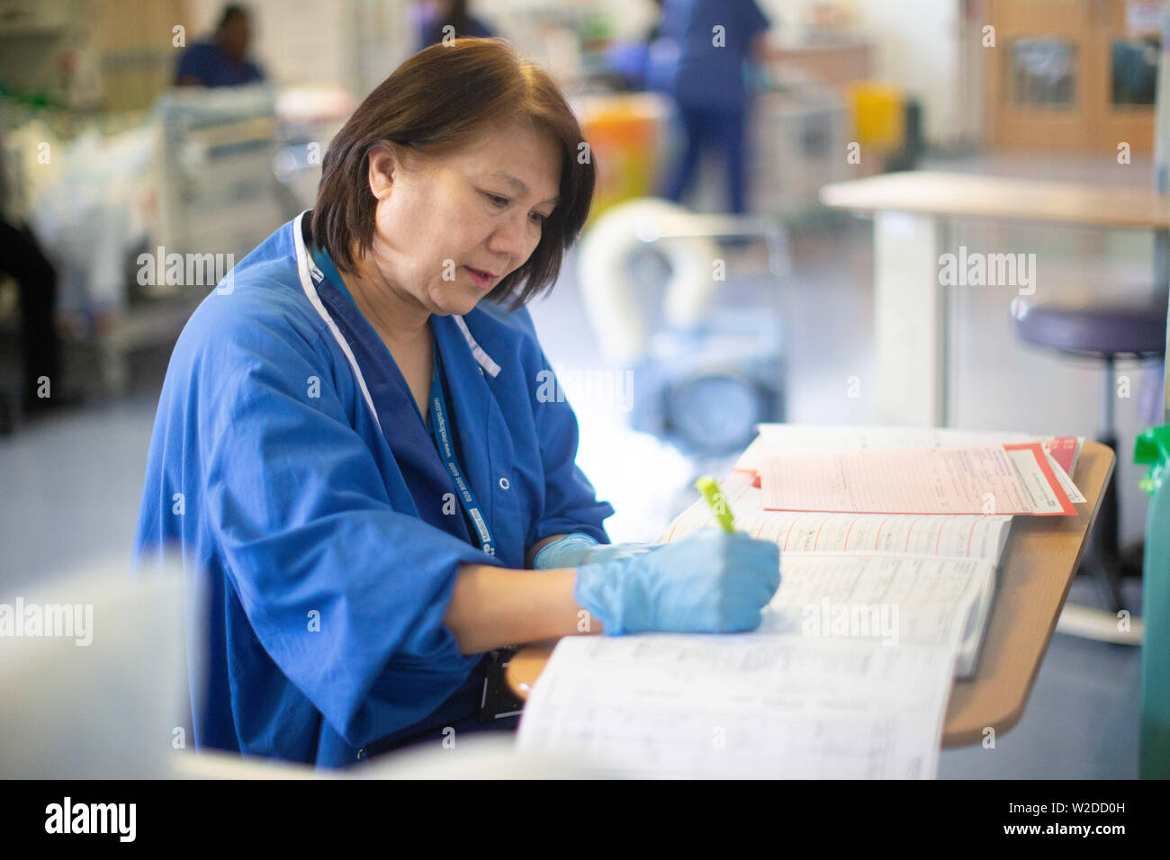 Nurse writing notes hi-res stock photography and images - Alamy