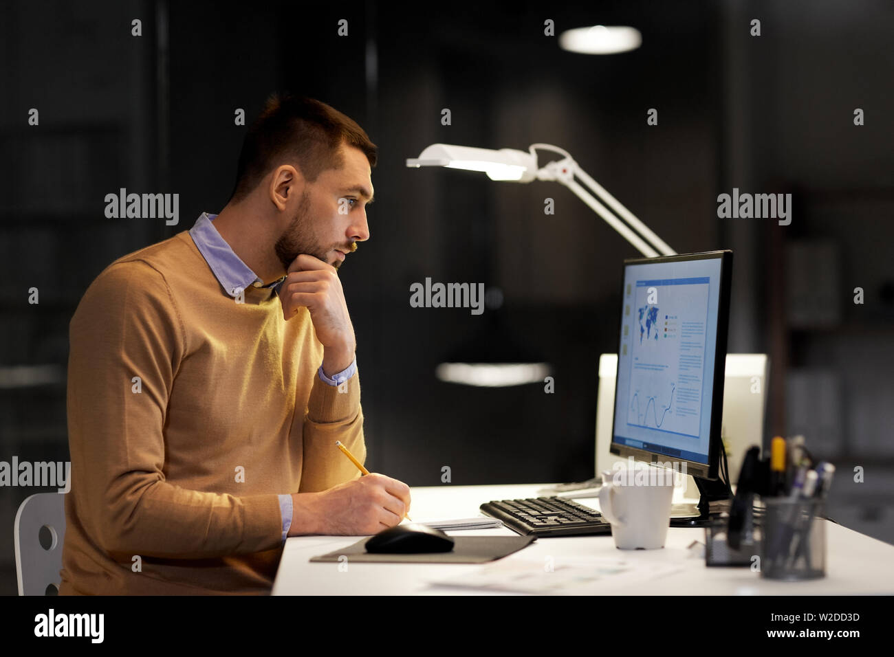 Man notepad working night hi-res stock photography and images - Alamy