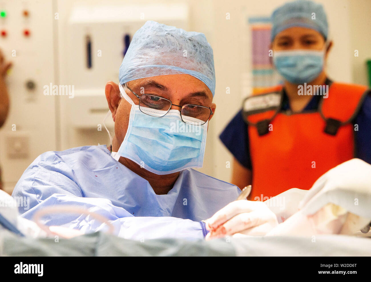 Surgeon in an NHS Hospital during an operation Stock Photo - Alamy