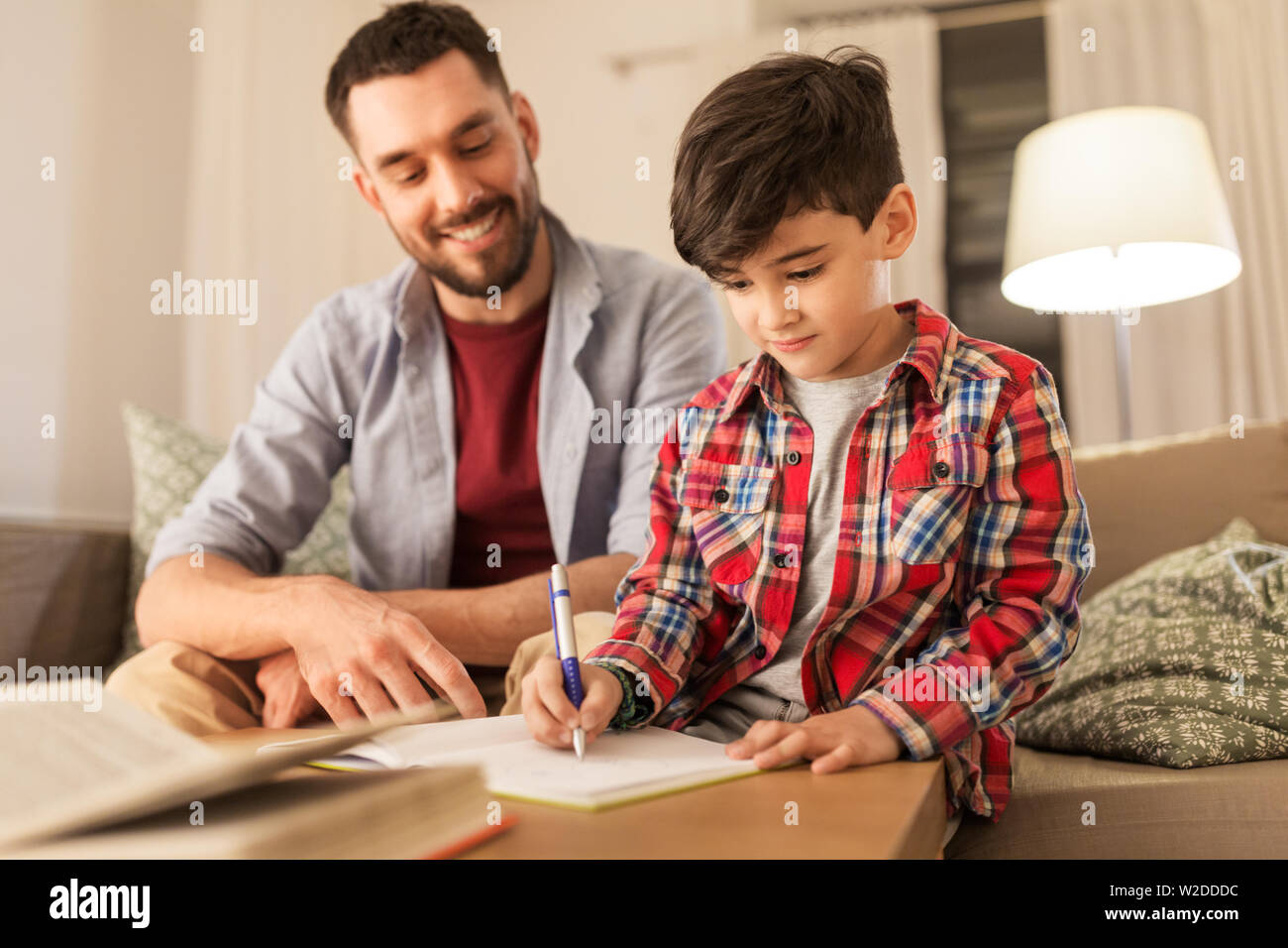 father and son doing homework together Stock Photo - Alamy
