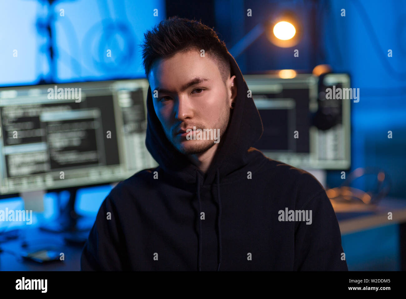 asian hacker in dark room with computers at night Stock Photo - Alamy