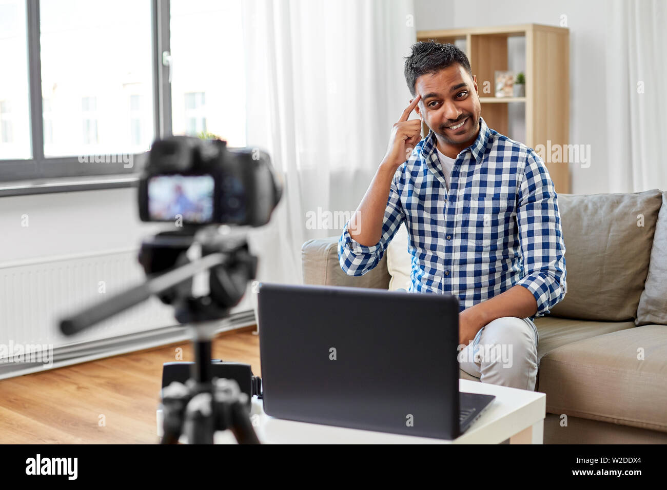 male blogger with camera videoblogging at home Stock Photo - Alamy