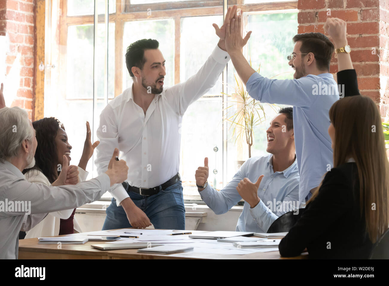 Celebration high five teammates hi-res stock photography and images - Alamy