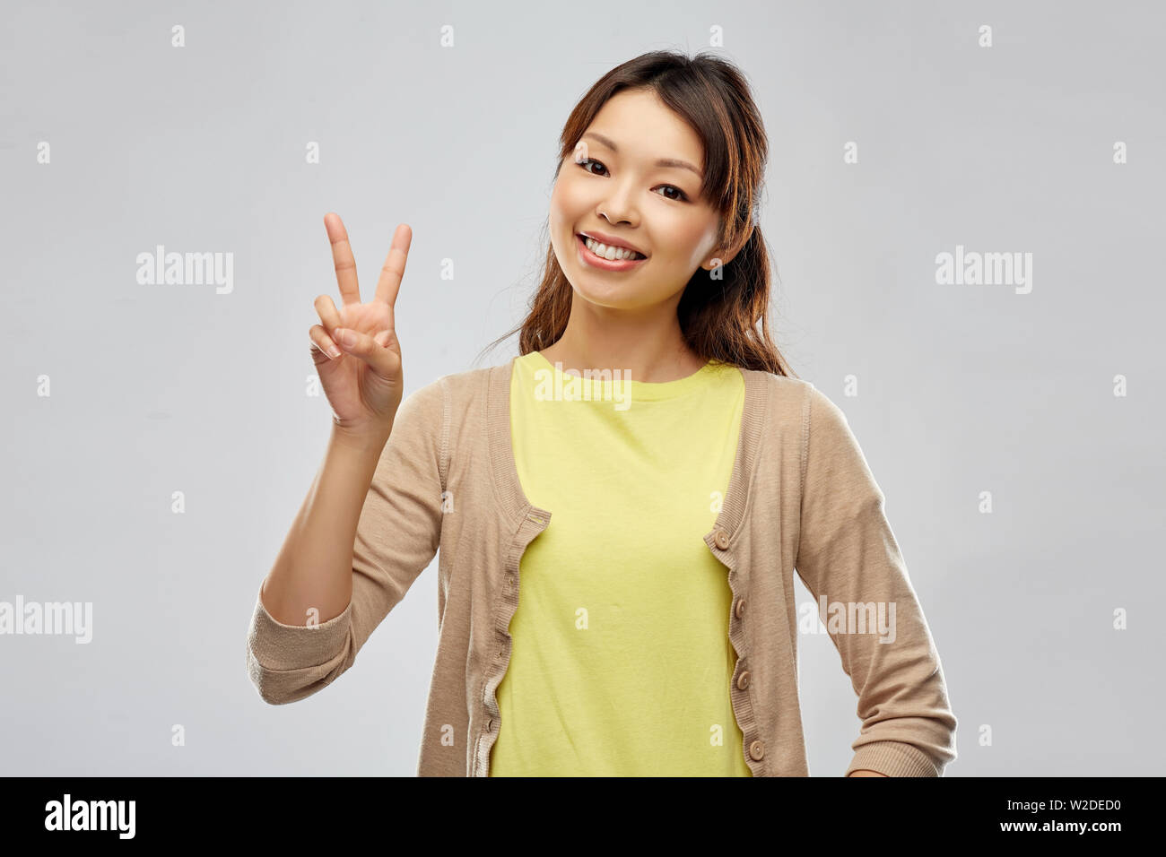 Asian Tourists Peace Sign