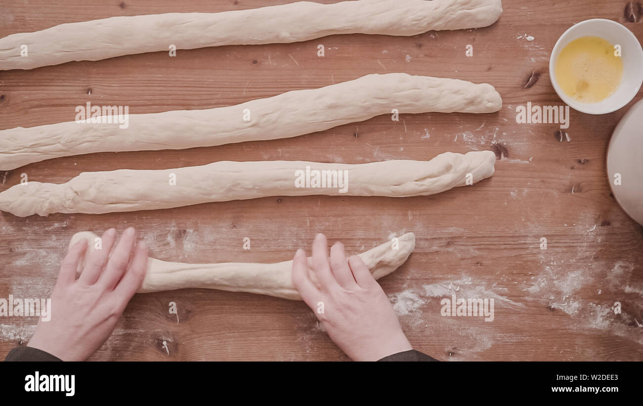 Flat lay. Step by step. Rolling dough into even parts to bake challah bread Stock Photo - Alamy
