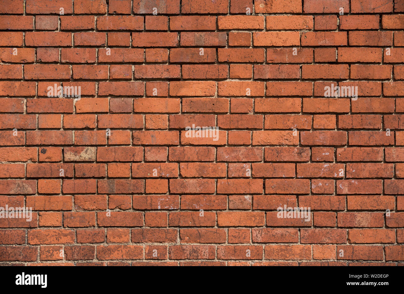 The mottled surface, pattern and texture of a red brick wall Stock ...