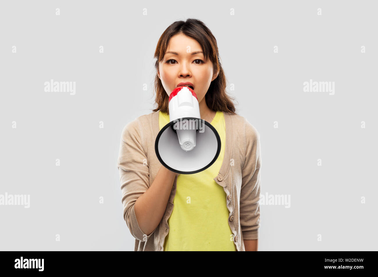 Young woman speaking voice hi-res stock photography and images - Alamy