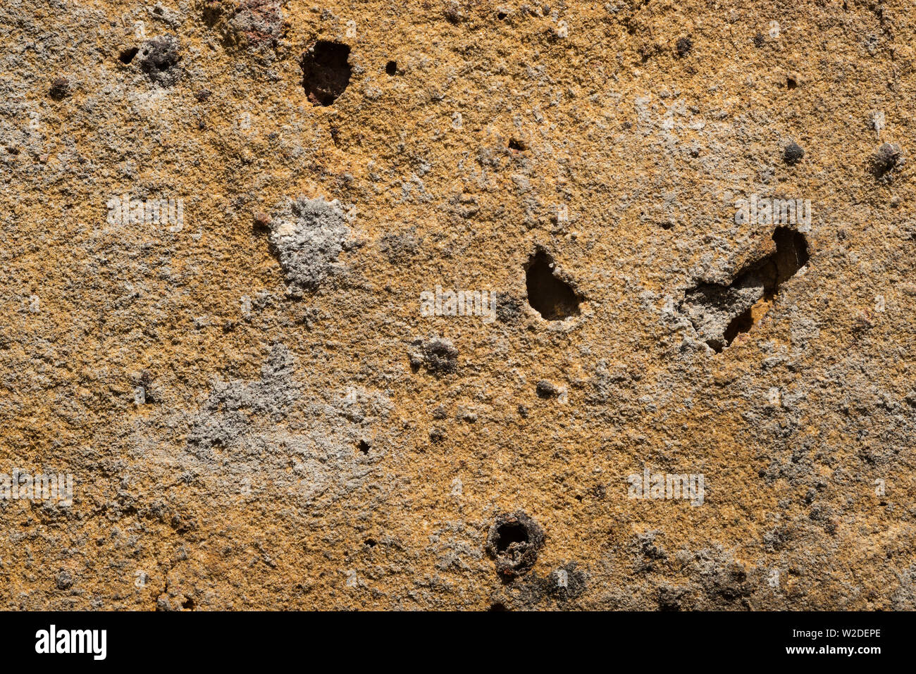 Close up of the mottled surface pattern and texture of handmade bricks ...