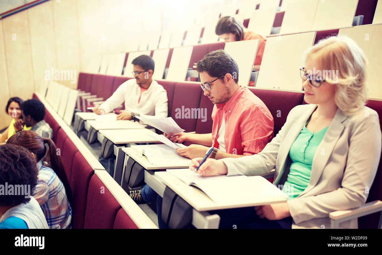 group of students writing test at lecture hall Stock Photo - Alamy