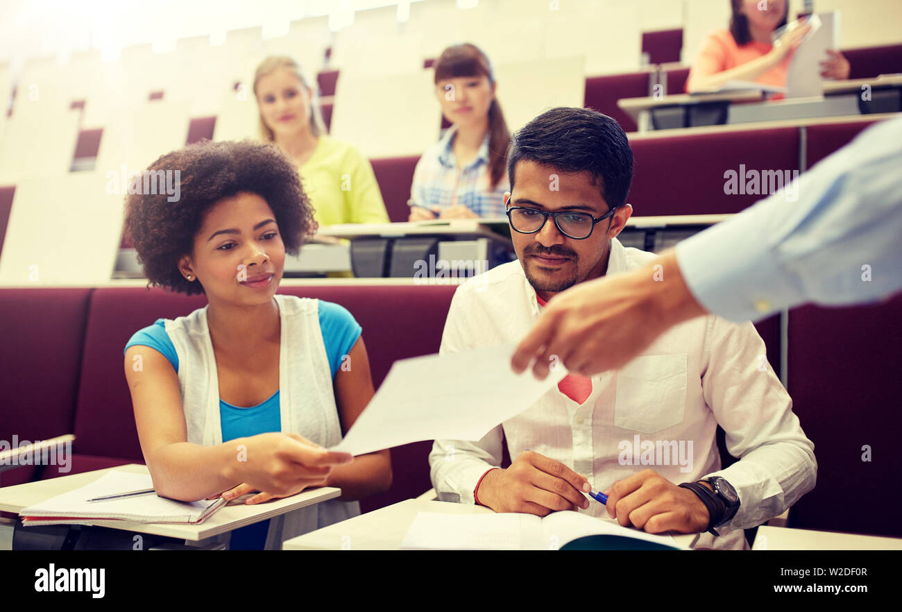 teacher giving tests to students at lecture Stock Photo - Alamy