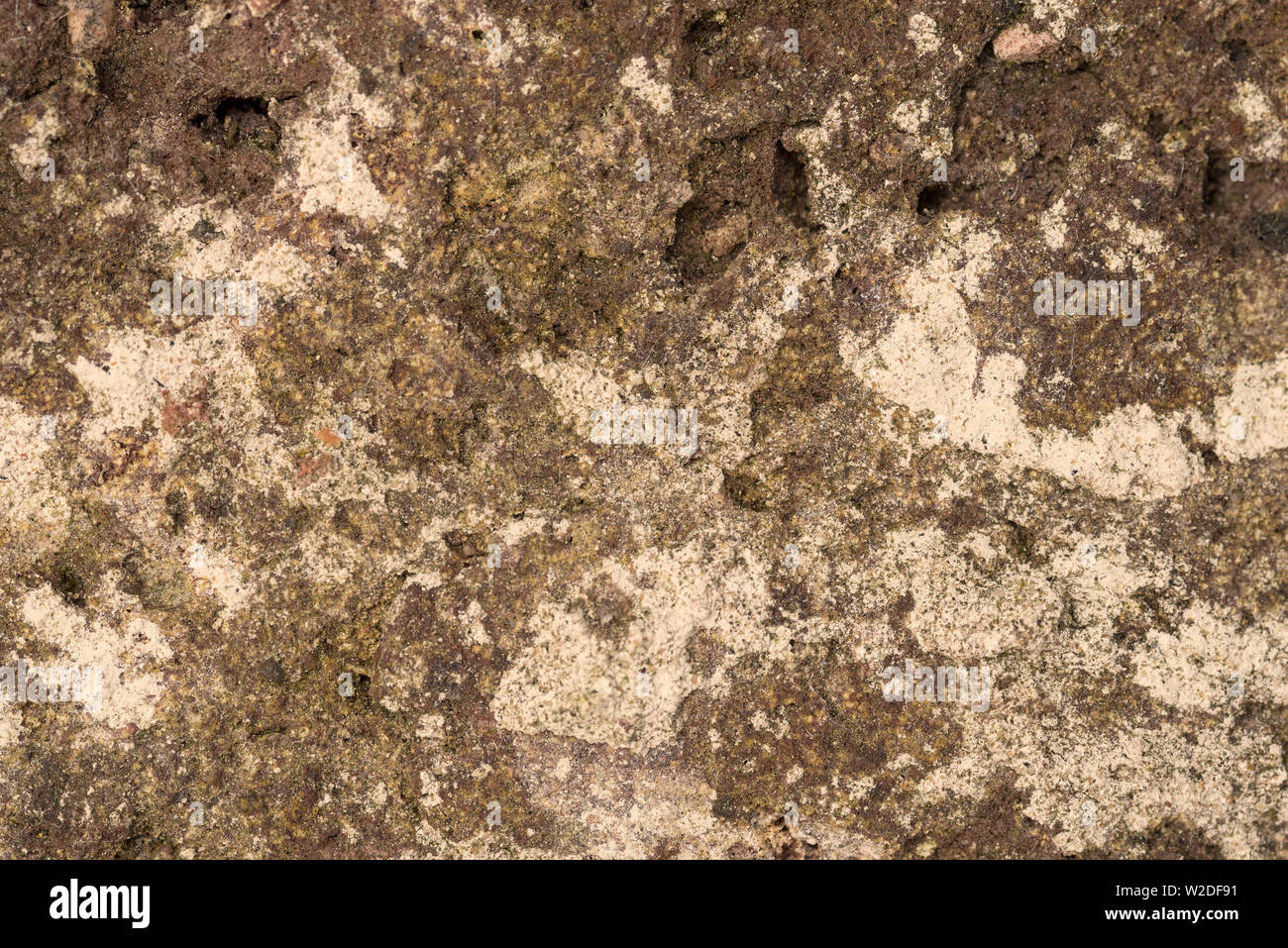 Close up of the mottled surface pattern and texture of handmade bricks ...