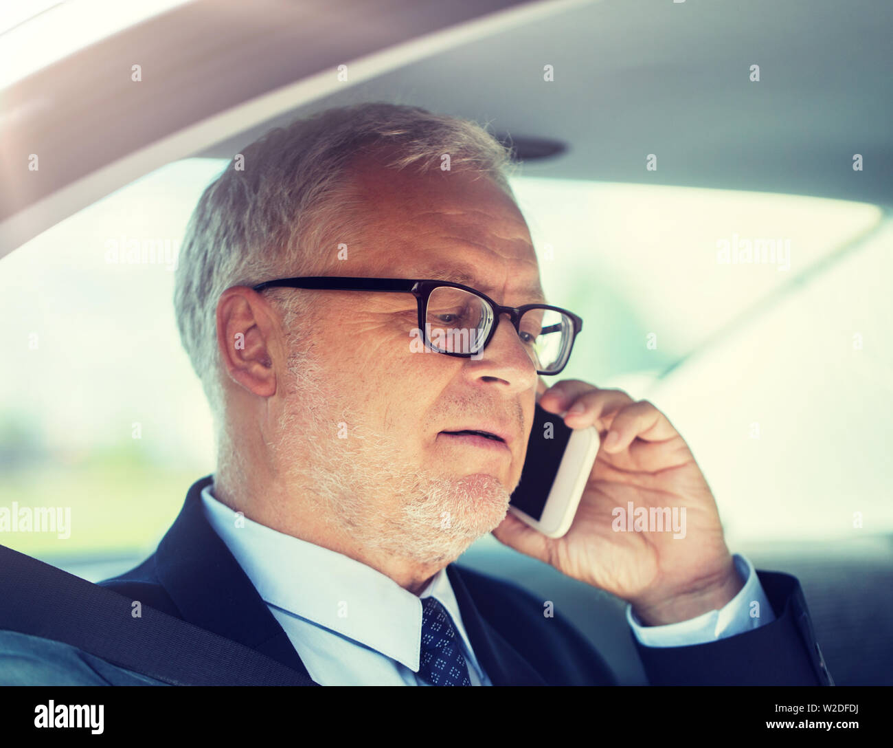 senior businessman calling on smartphone in car Stock Photo - Alamy