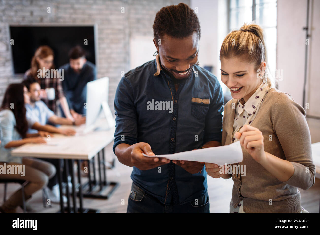 Portrait of architects having discussion in office Stock Photo - Alamy