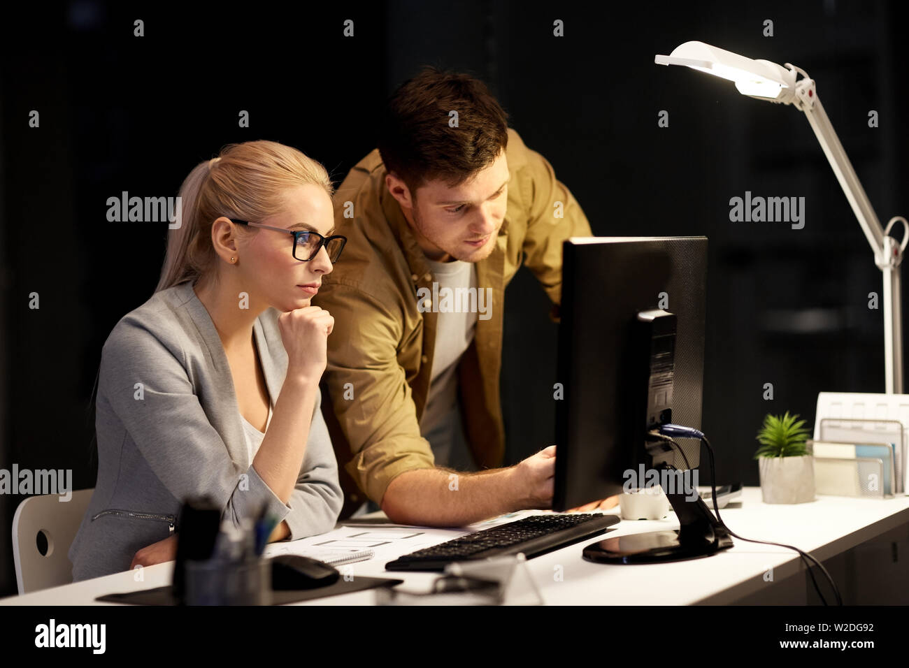 business team with computer at night office Stock Photo - Alamy
