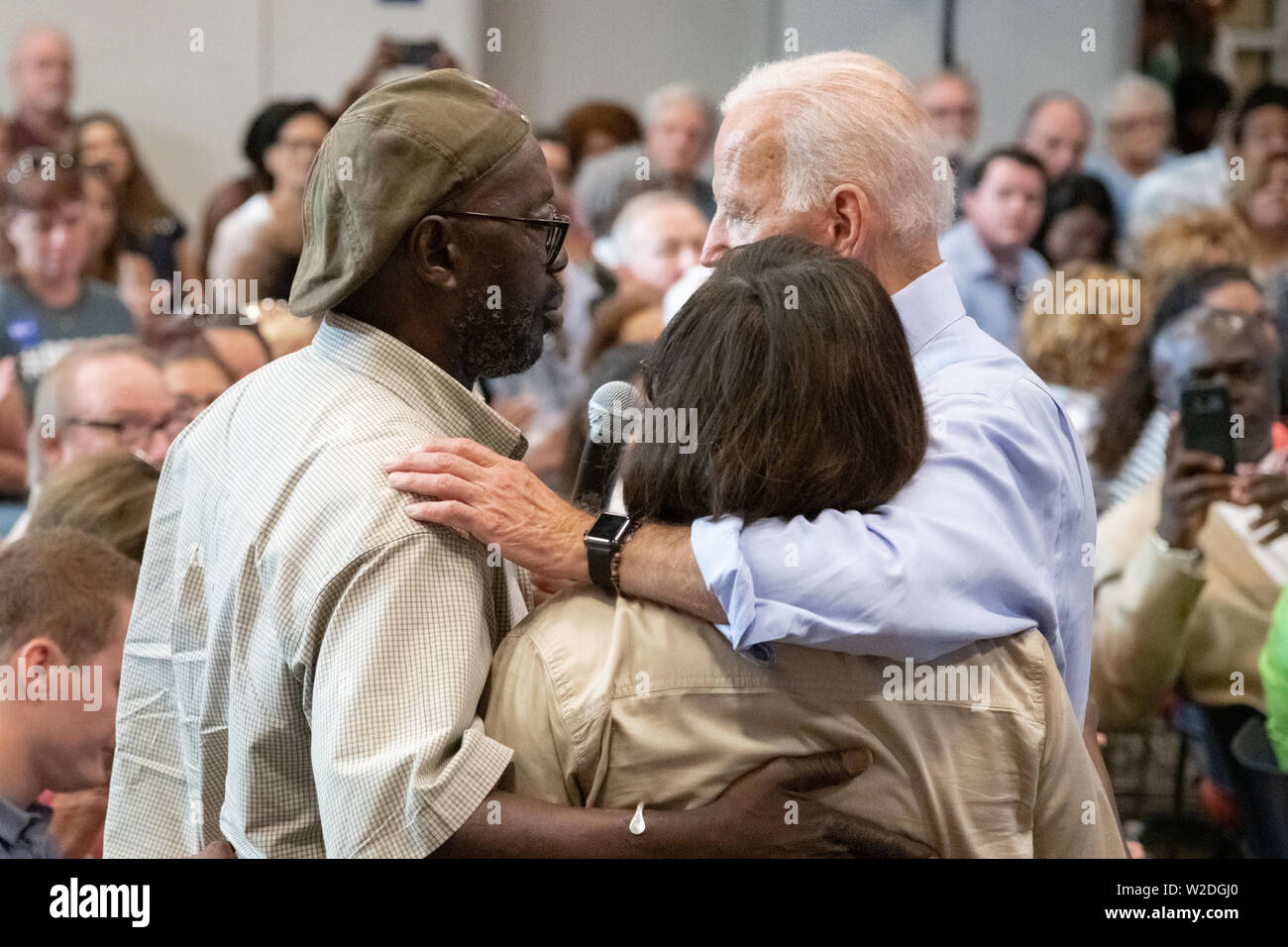 Former Vice President Joe Biden embraces Felicia and Tyrone Sanders ...
