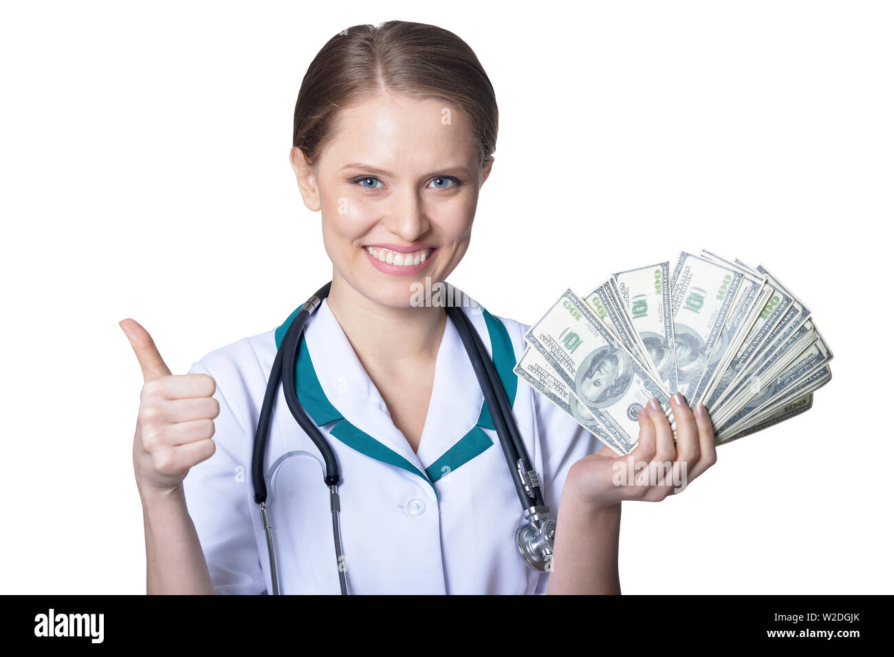 Portrait of female doctor holding money on white background Stock Photo ...