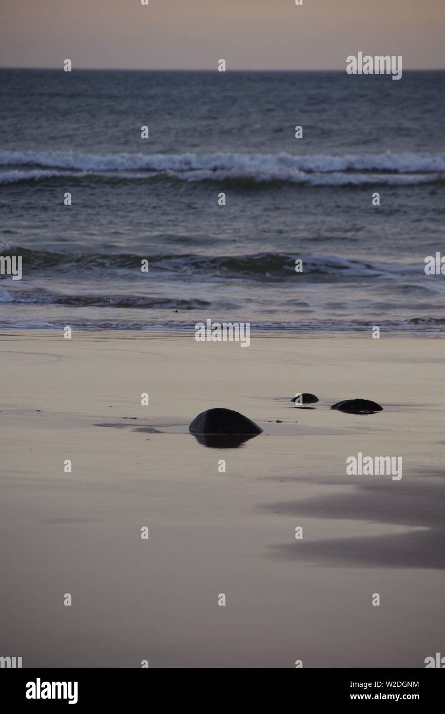Rounded boulder on a beach hi-res stock photography and images - Alamy